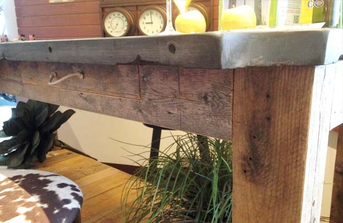 Industrial bar table made of recycled wood and repurposed billiard slate